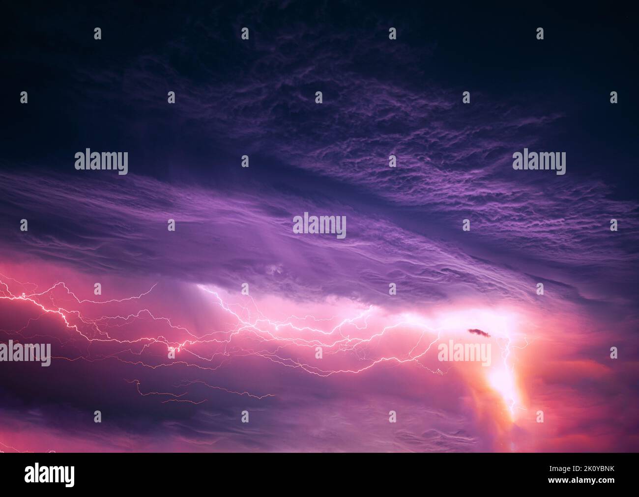 Bright Lightning On Purple Night Sky During Thunderstorm. Multiple ...