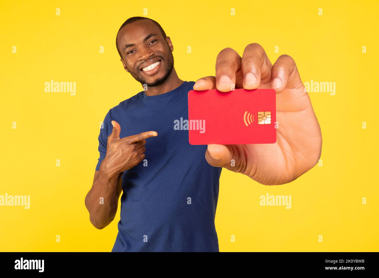 Cheerful African American Guy Showing Credit Card On Yellow Background ...