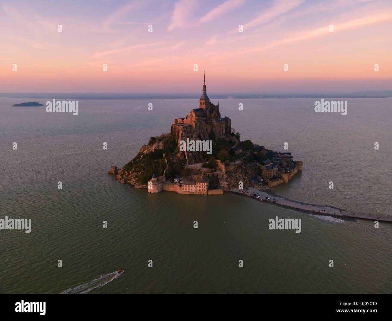 Aerial view of famous Le Mont-Saint-Michel at sunset in Normandie ...