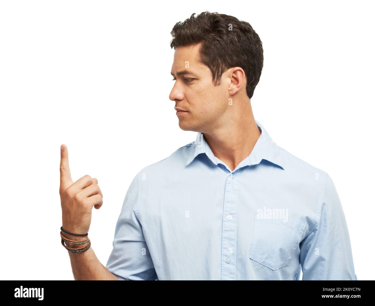 Spinning a few ideas. A handsome young man spinning something on his ...