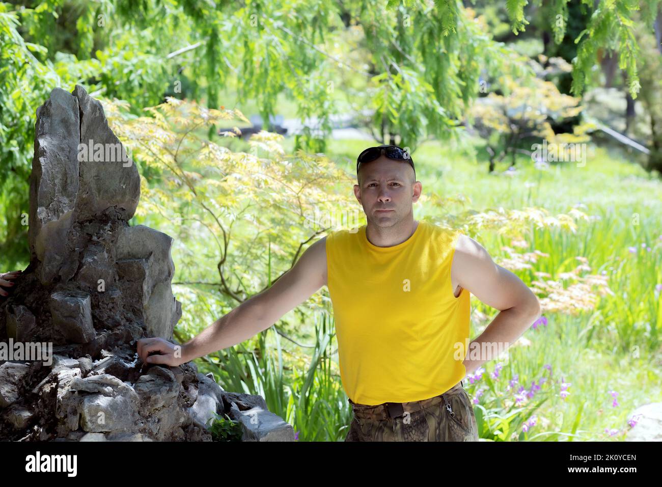 a bald man stands in a park. Walk and rest in park Stock Photo - Alamy