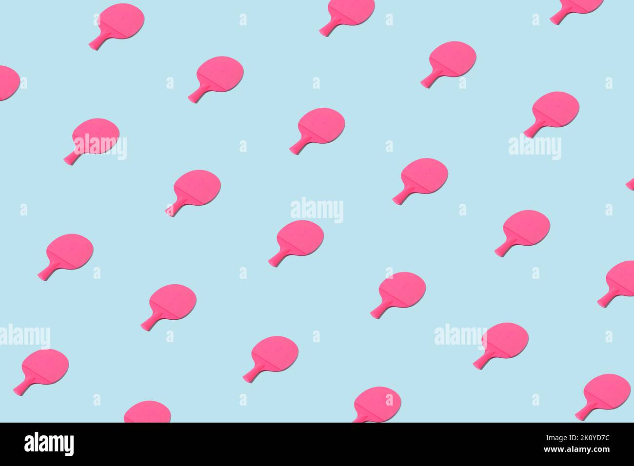 Pattern made of pink table tennis rackets on blue background. Minimal ...
