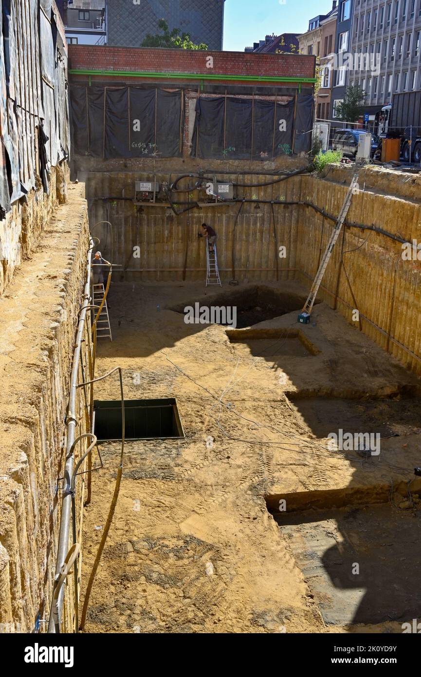 Antwerp, Belgium - August 2022: Construction workers in a large hole ...