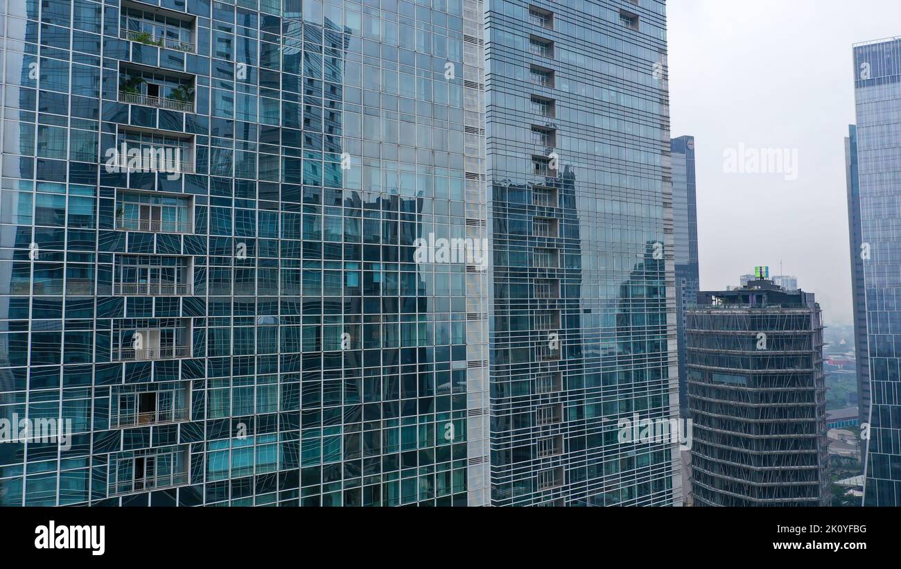Blue glass modern skyscraper and office building in Jakarta. Glass ...