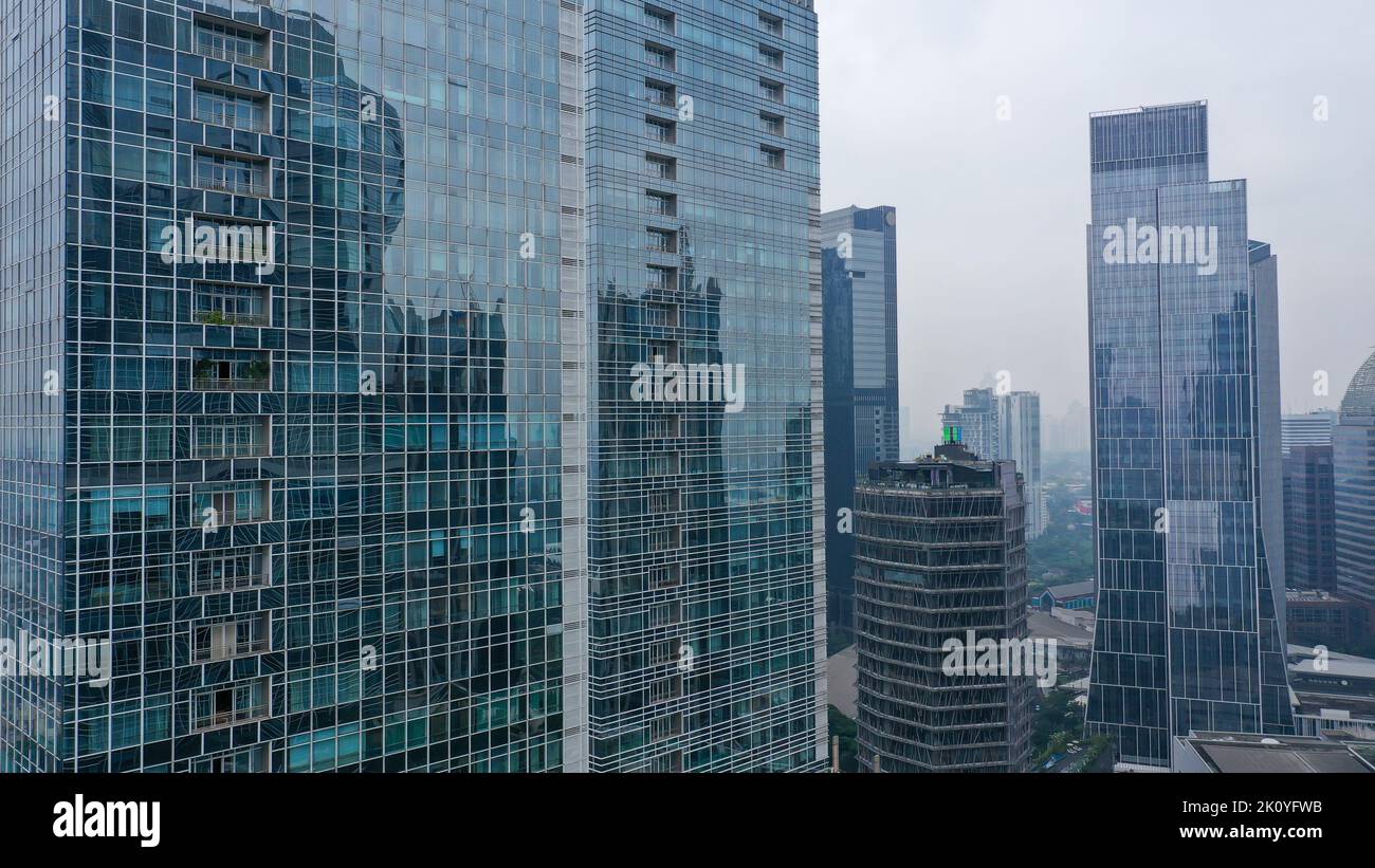 Blue glass modern skyscraper and office building in Jakarta. Glass ...