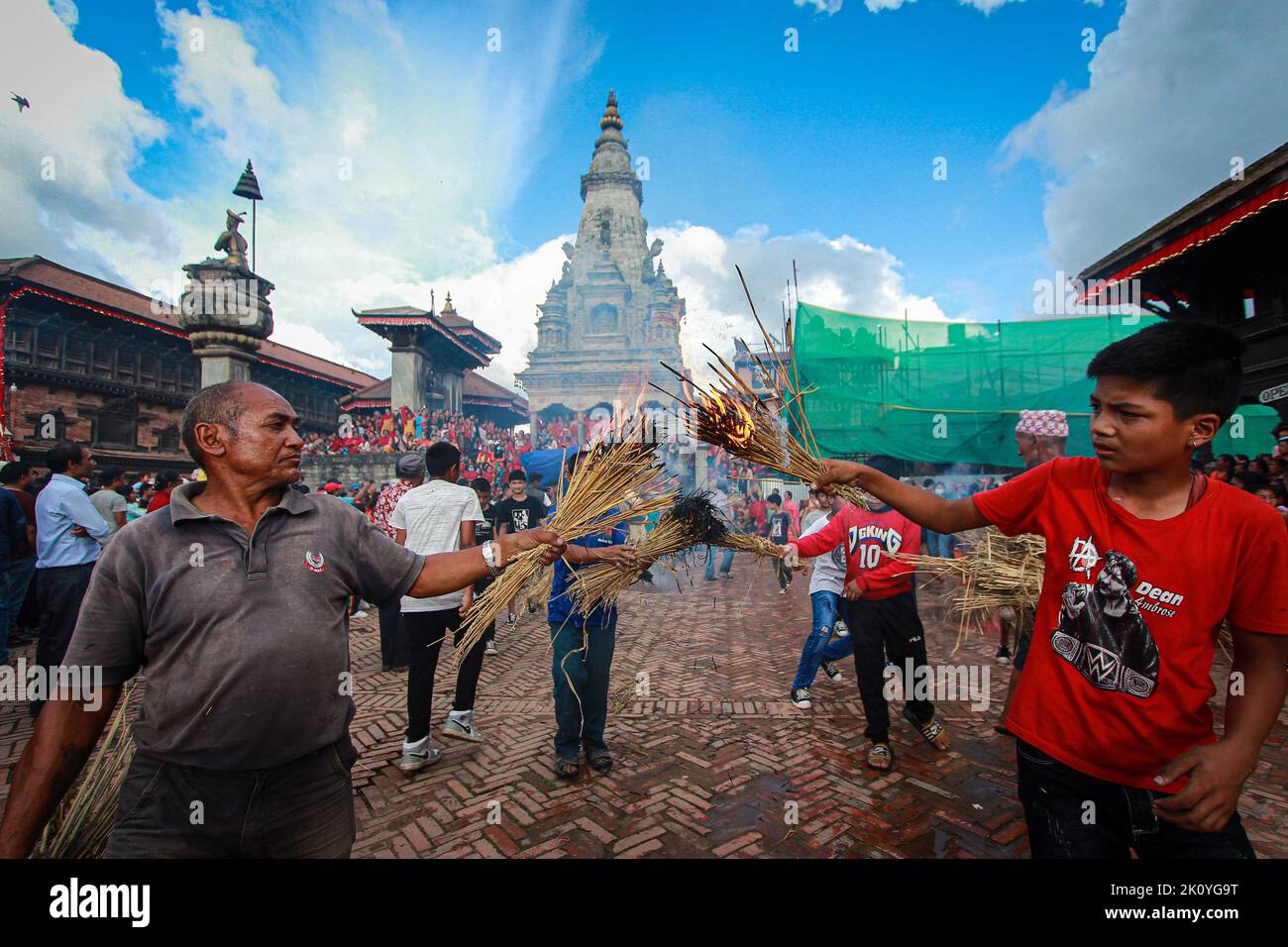 Bhaktapur, Bagmati, Nepal. 14th Sep, 2022. A man lights hay as a part ...