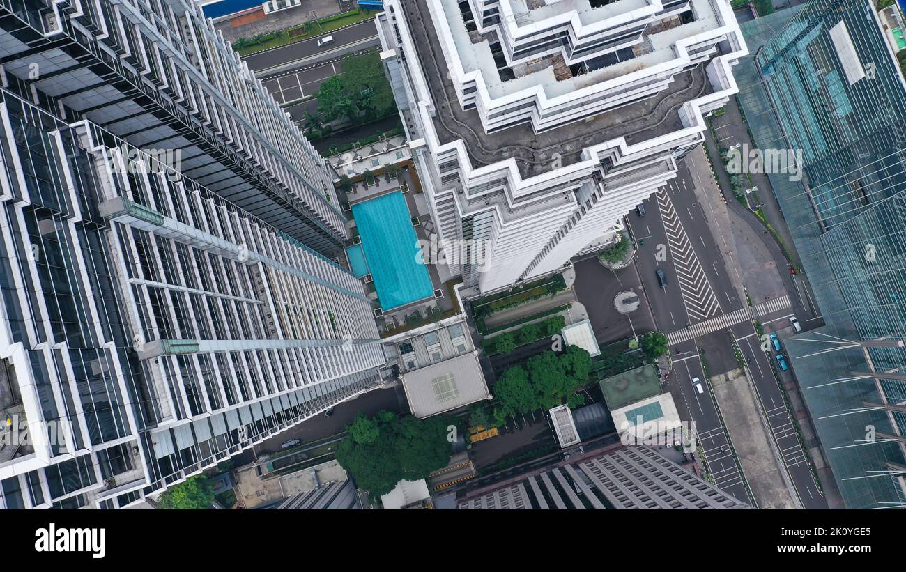 Top down view on different sky scrapers in a big city, fly over Stock ...