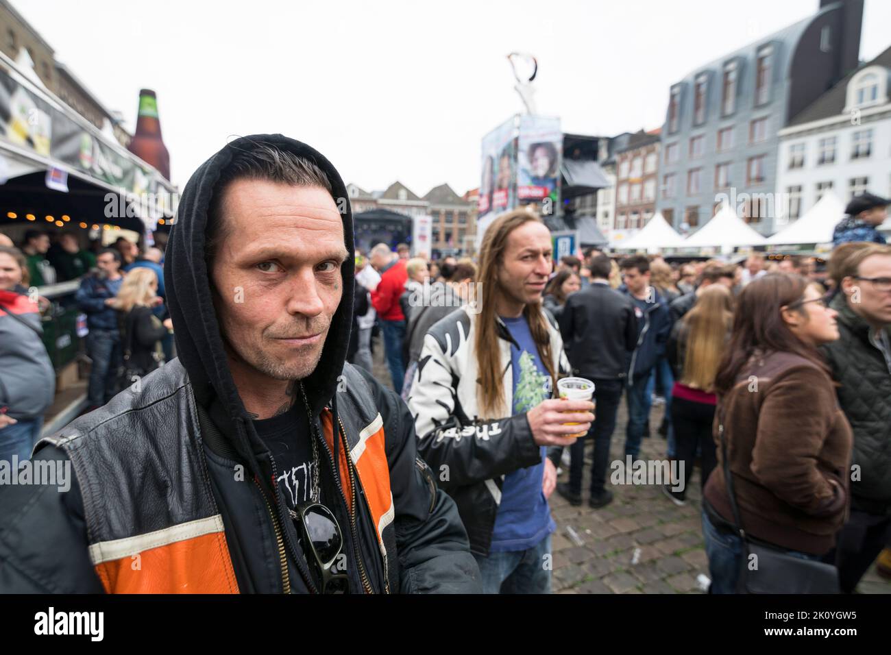 Two men enjoying a rock concert among the audience at liberation day ...