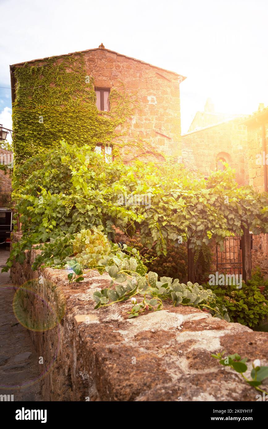 Picturesque building in medieval town in Tuscany. Old stone walls and ...