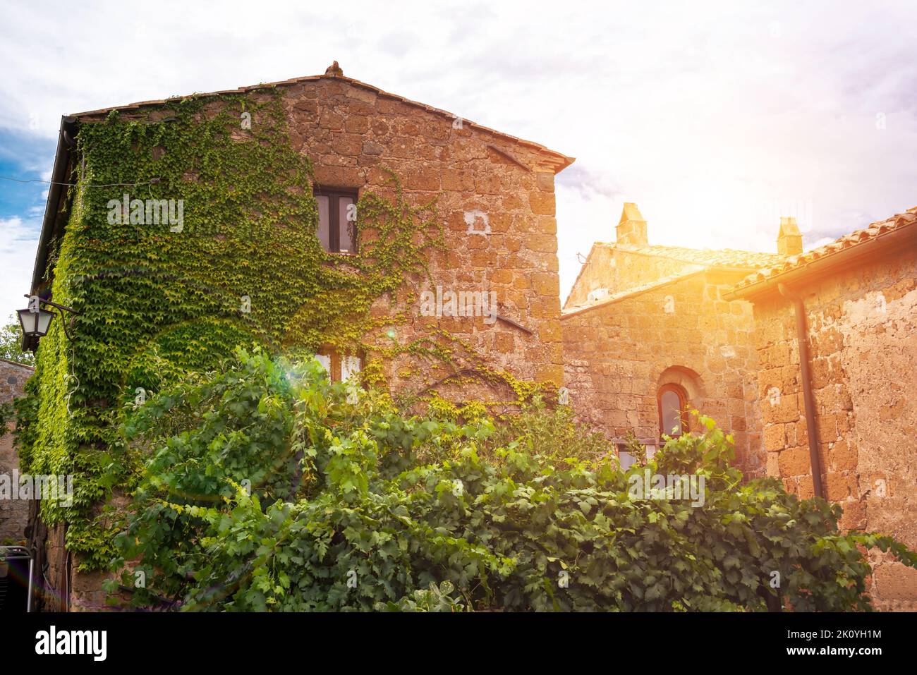 Picturesque building in medieval town in Tuscany. Old stone walls and ...