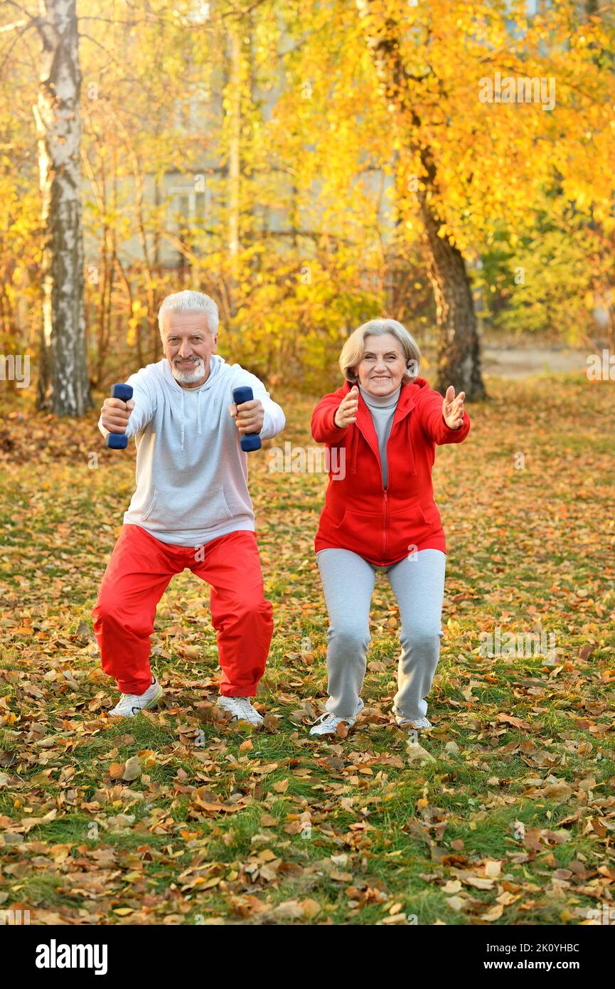 Elderly couple doing sports in the park Stock Photo - Alamy