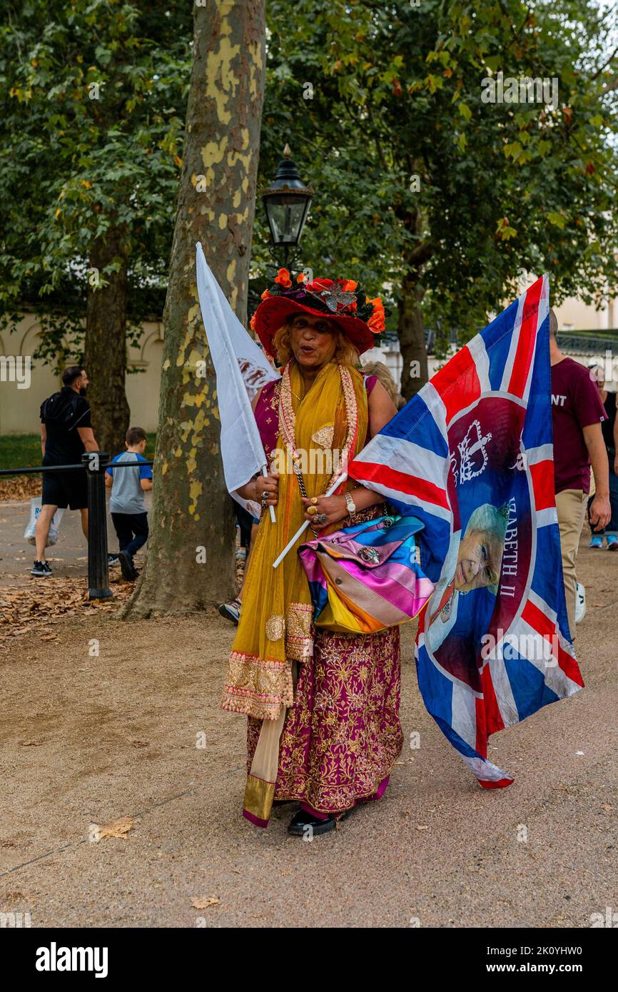 A royalist mourner makes her way to Buckingham Palace after the death ...