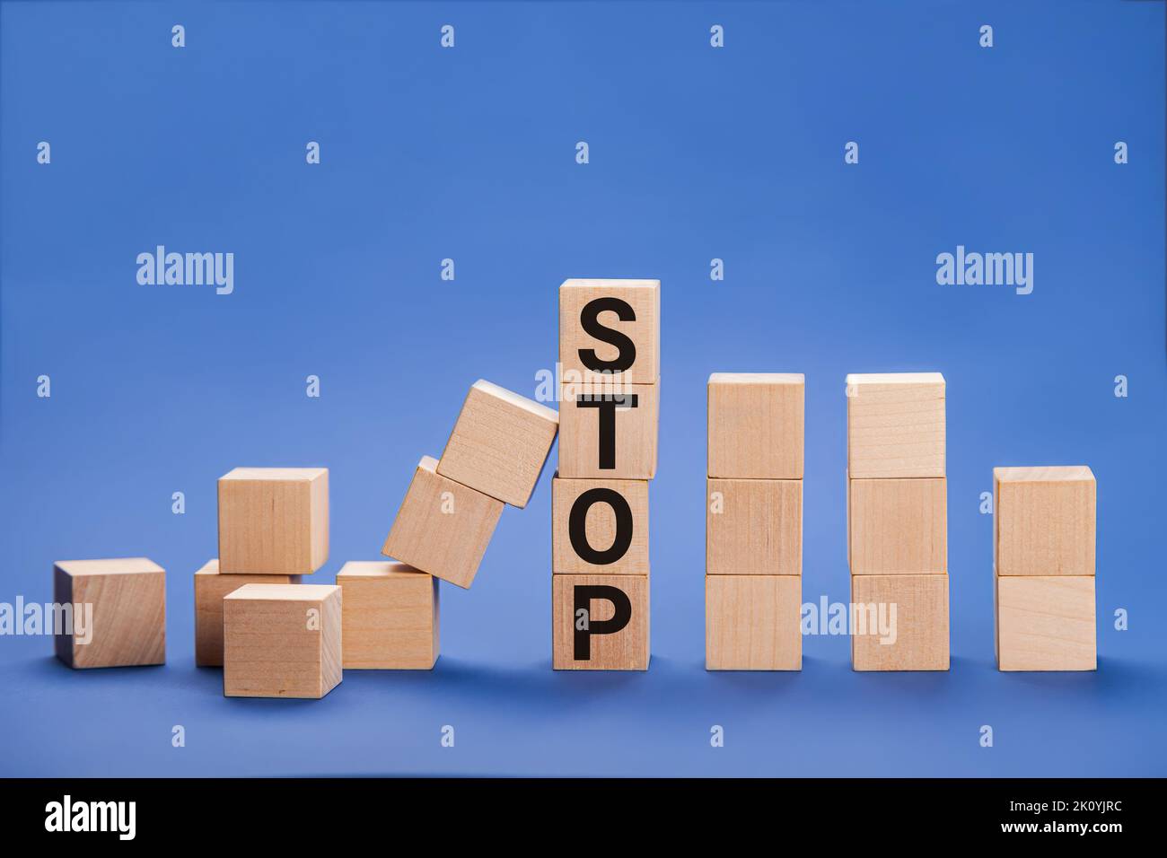 Stop wording print on wooden block cube protect wooden falling domino ...