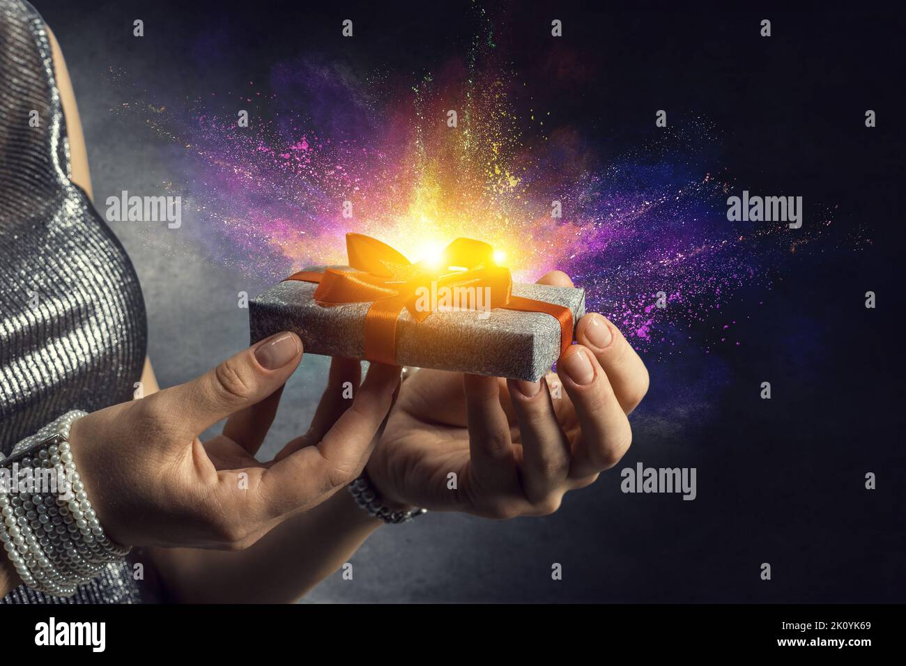 Closeup hands giving surprise gift box Stock Photo - Alamy