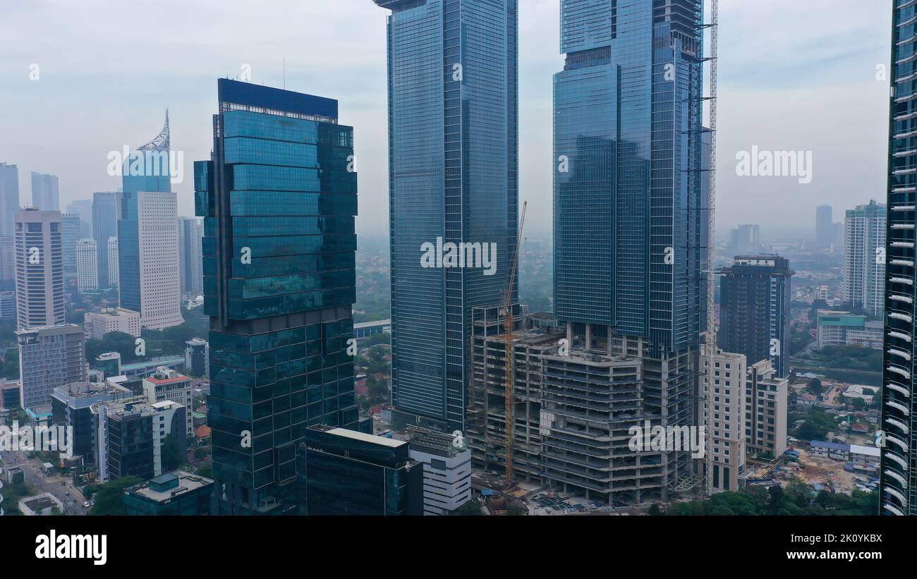 Beautiful aerial view of misty morning covered skyscrapers and housing ...