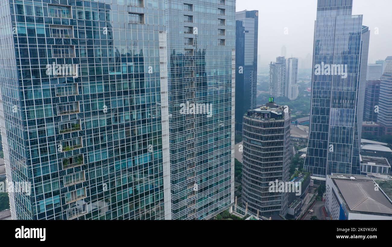 Blue glass modern skyscraper and office building in Jakarta. Glass ...
