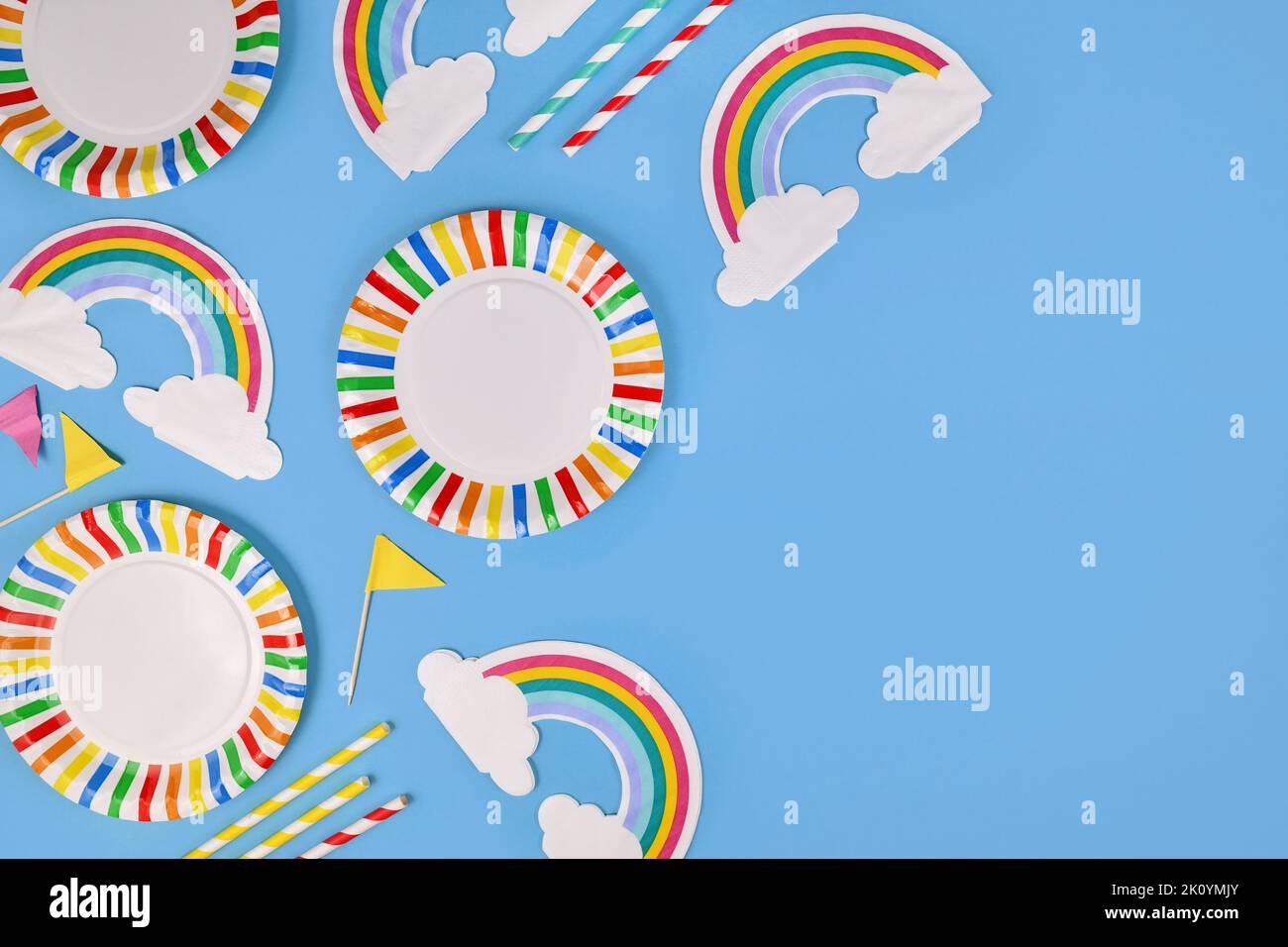 Party flat lay with colorful plates, rainbow napkins and drinking ...