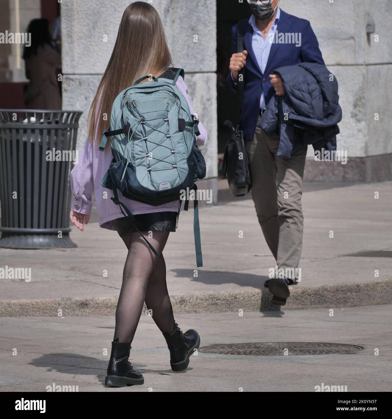 Schoolgirl walking in the square Stock Photo - Alamy