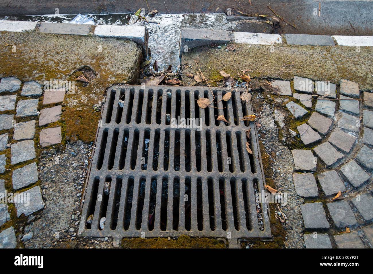 Big square sewer manhole cover on the footpath, top view. Dehradun City ...