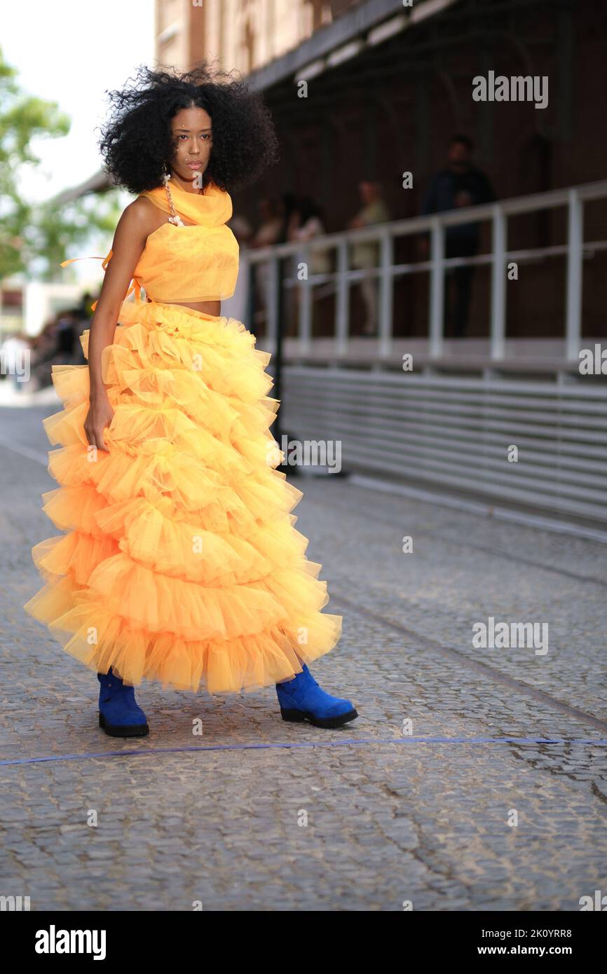A model walks the runway wearing a creation by María Lafuente ...