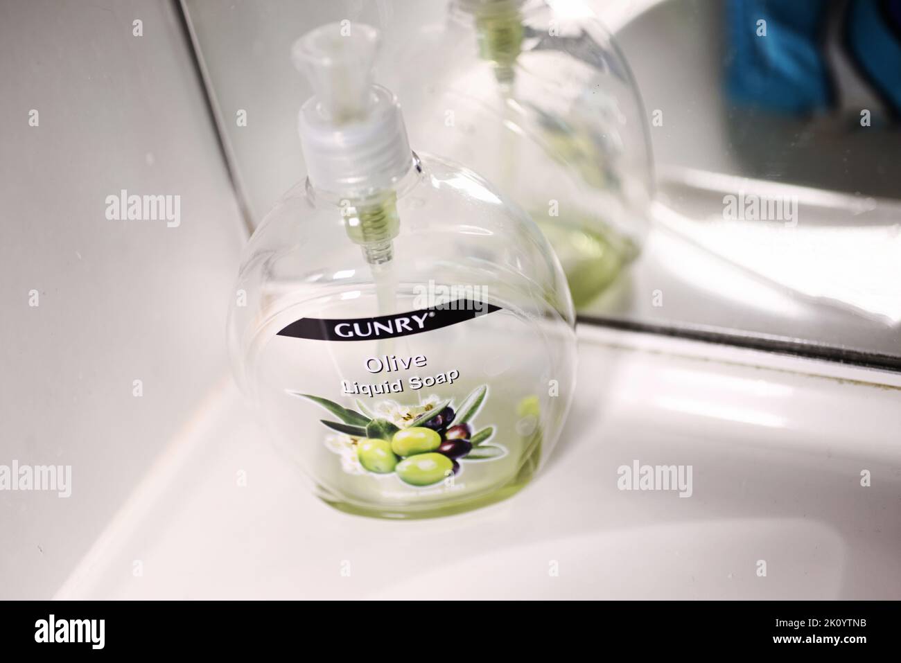 An empty olive liquid soap bottle from Gunry, here in a bathroom Stock ...