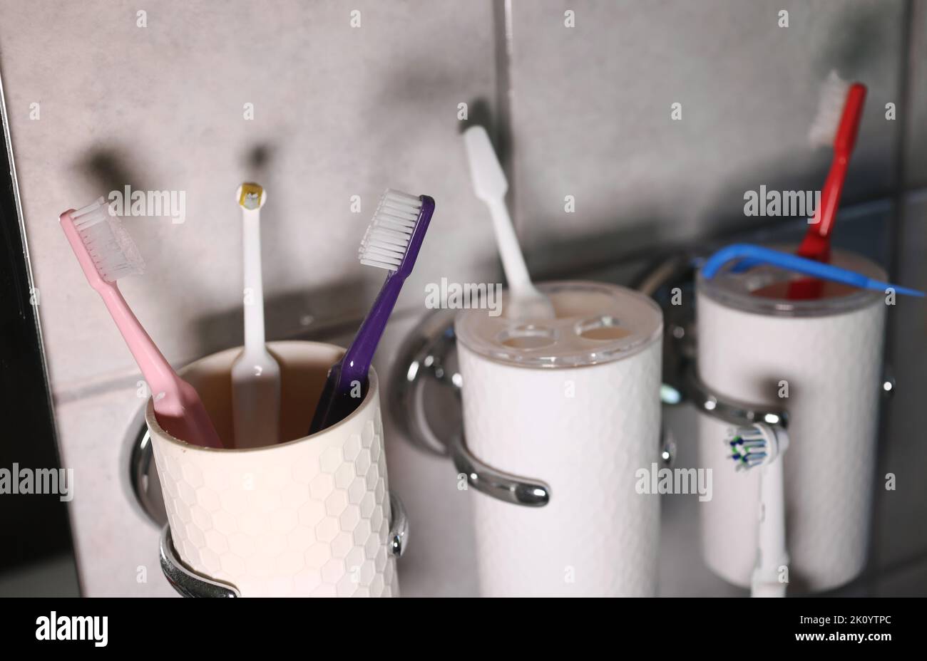 Toothbrushes in a bathroom Stock Photo - Alamy