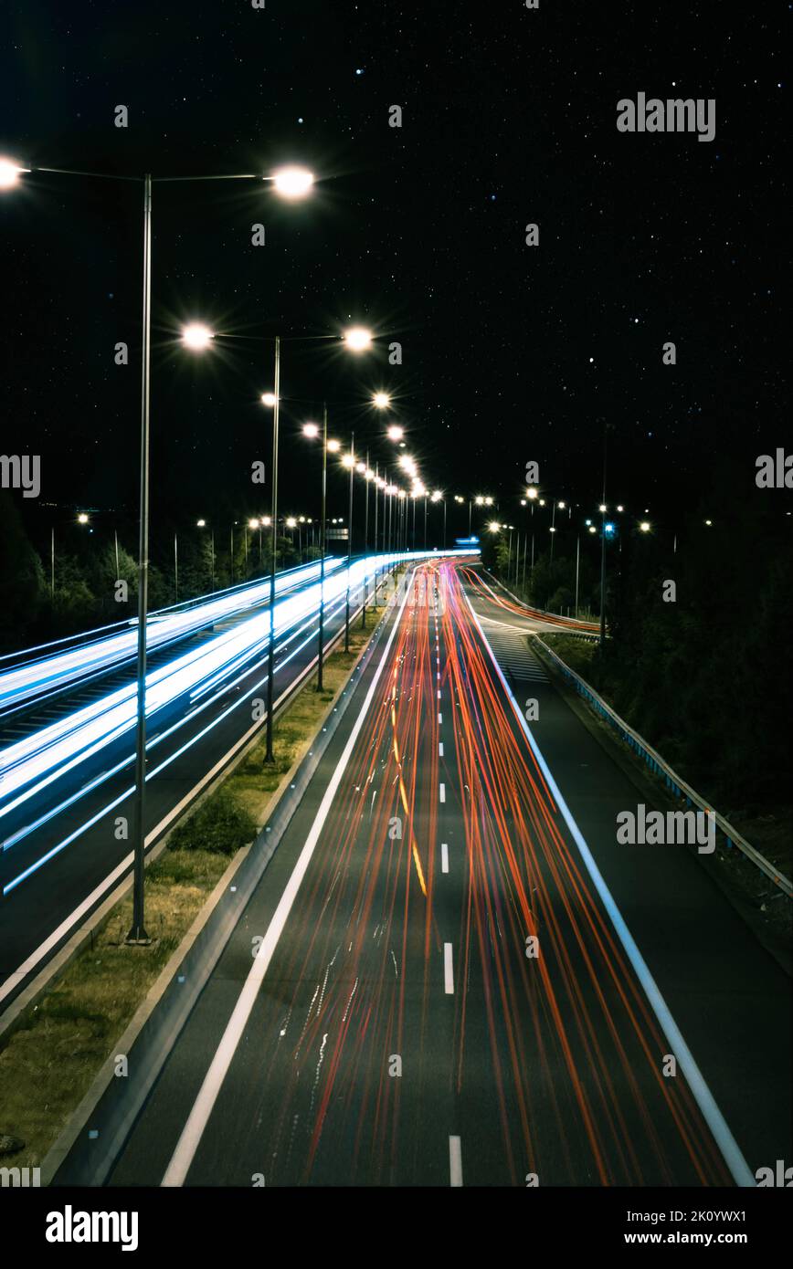 A road with lights at night in Arkitsa Stock Photo - Alamy