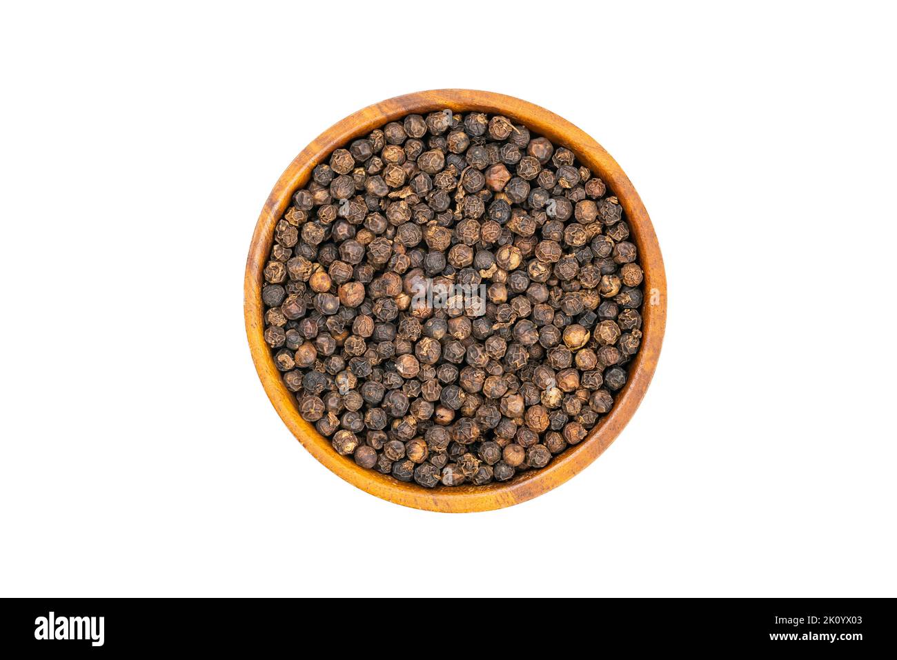 Top view or flat lay of fresh raw black pepper in wooden bowl isolated ...