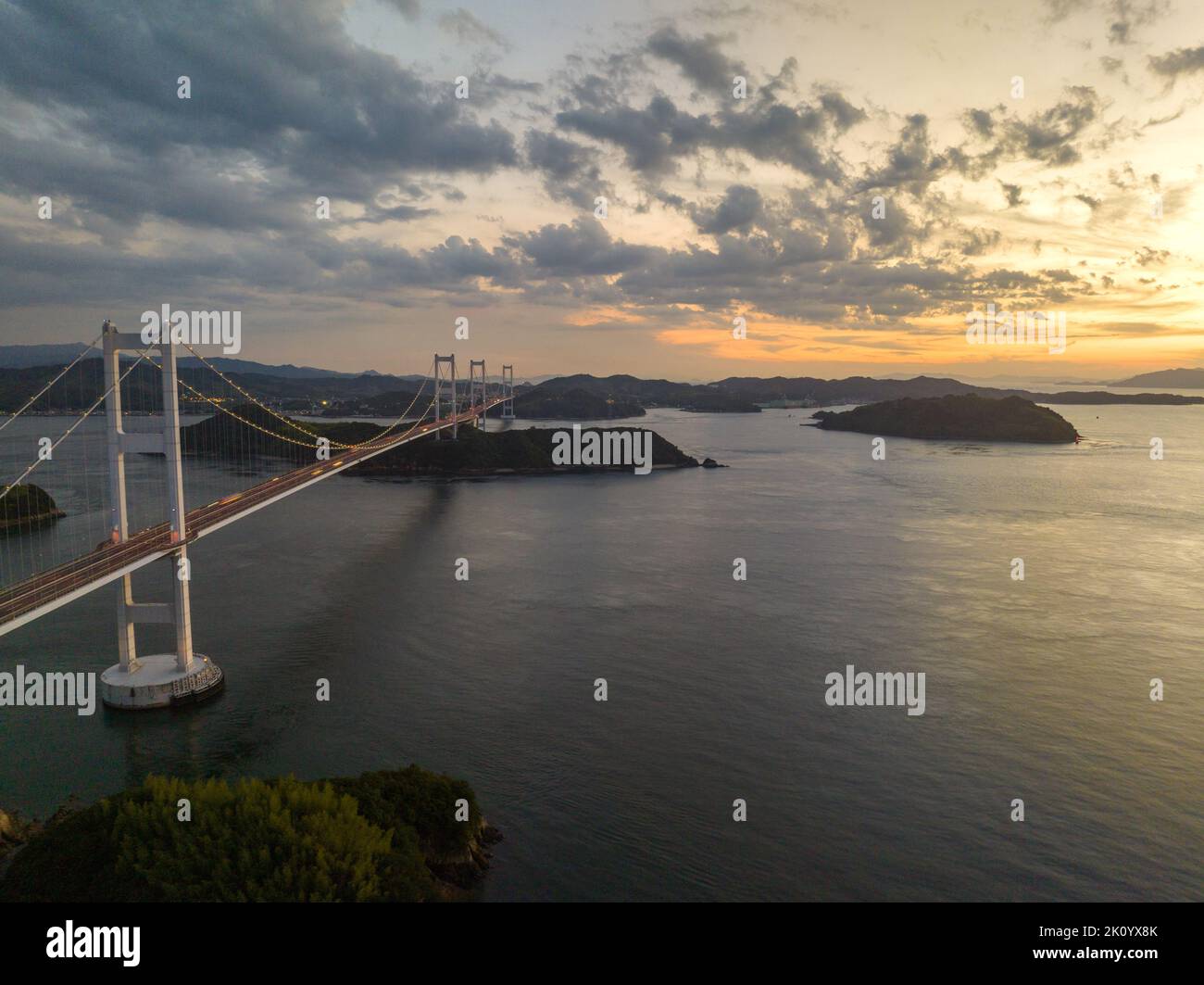 Sunset glow over long bridge between islands in the Seto Inland Sea ...