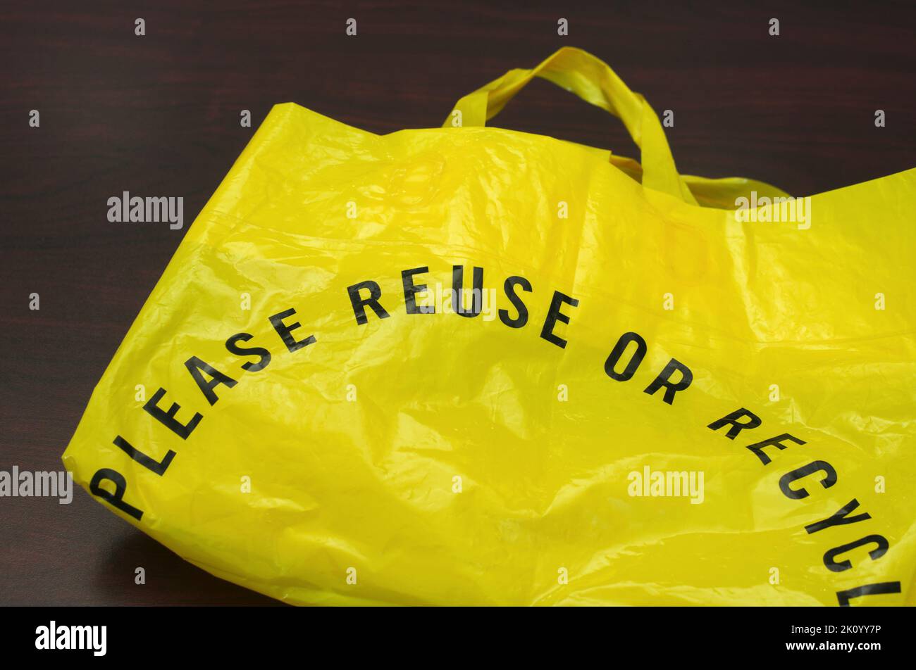 please reuse or recycle me written on a plastic bag Stock Photo - Alamy