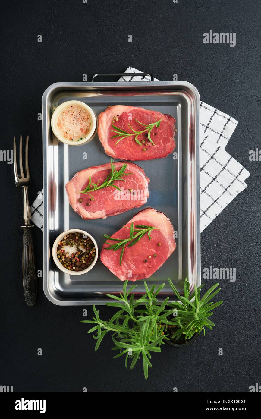 Steaks. Fresh Filet mignon Steaks with spices rosemary and pepper in ...