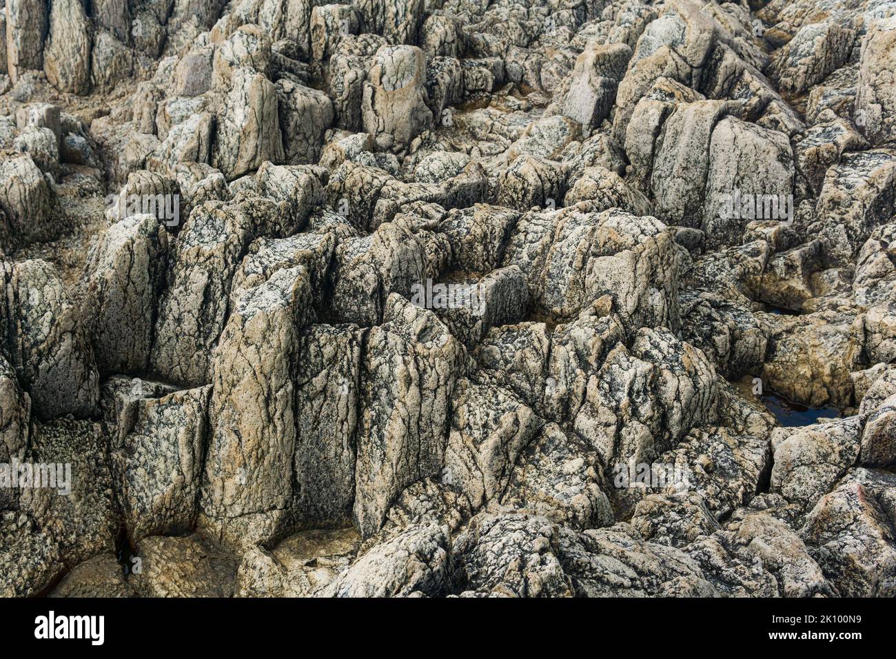 natural stone background, the remains of lava basalt columns form a ...