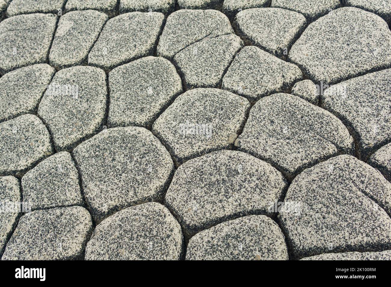 natural stone background, the remains of lava basalt columns form a ...