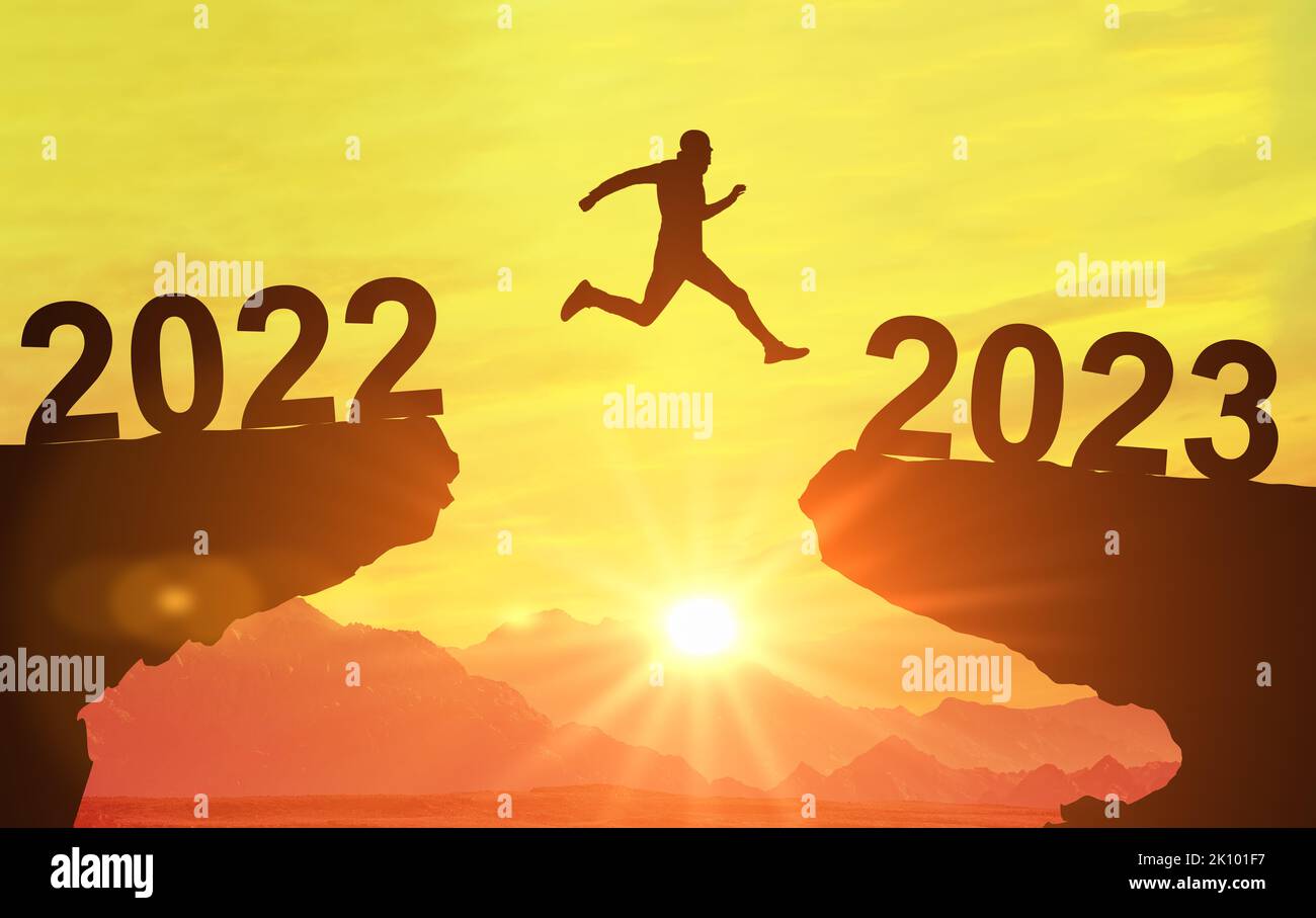 2023. Silhouette man jumping between cliff with number 2022 to 2023 ... 2023. Silhouette man jumping between cliff with number 2022 to 2023 ...