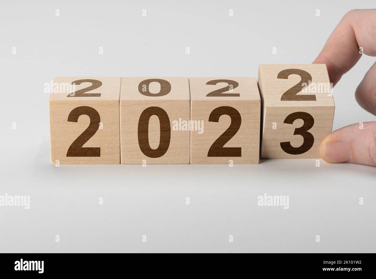 Wooden cube flipping, change from 2022 to 2023. happy new year concept, cube block change from ...