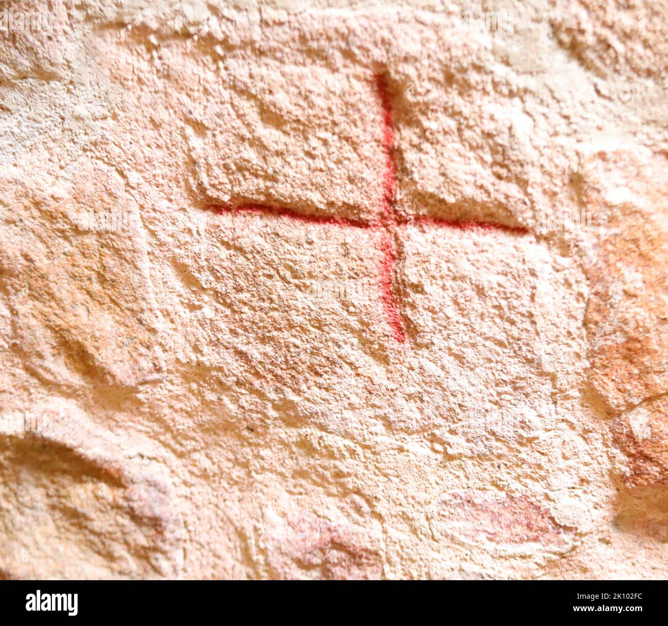 old cross engraved on the wall of an ancient Christian church symbol of ...