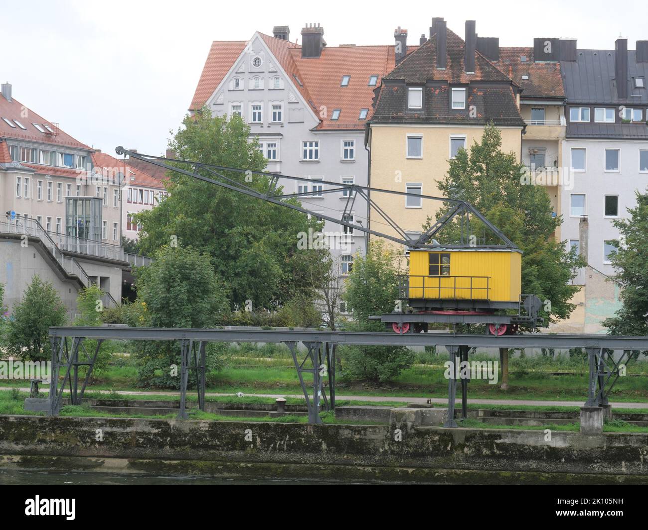 Old historical yellow loading crane running on rails for freighters on ...