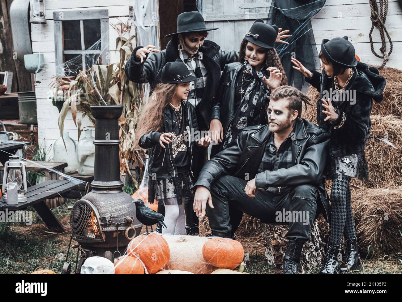 Scary family, mother, father, daughters celebrating halloween ...