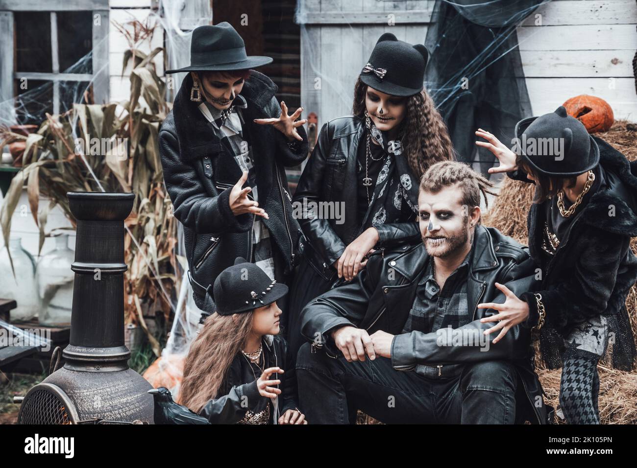 Scary family, mother, father, daughters celebrating halloween ...