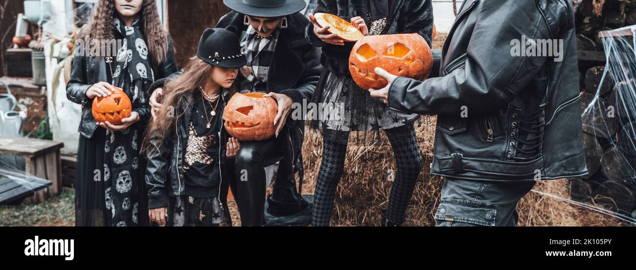 Scary family, mother, father, daughters celebrating halloween ...