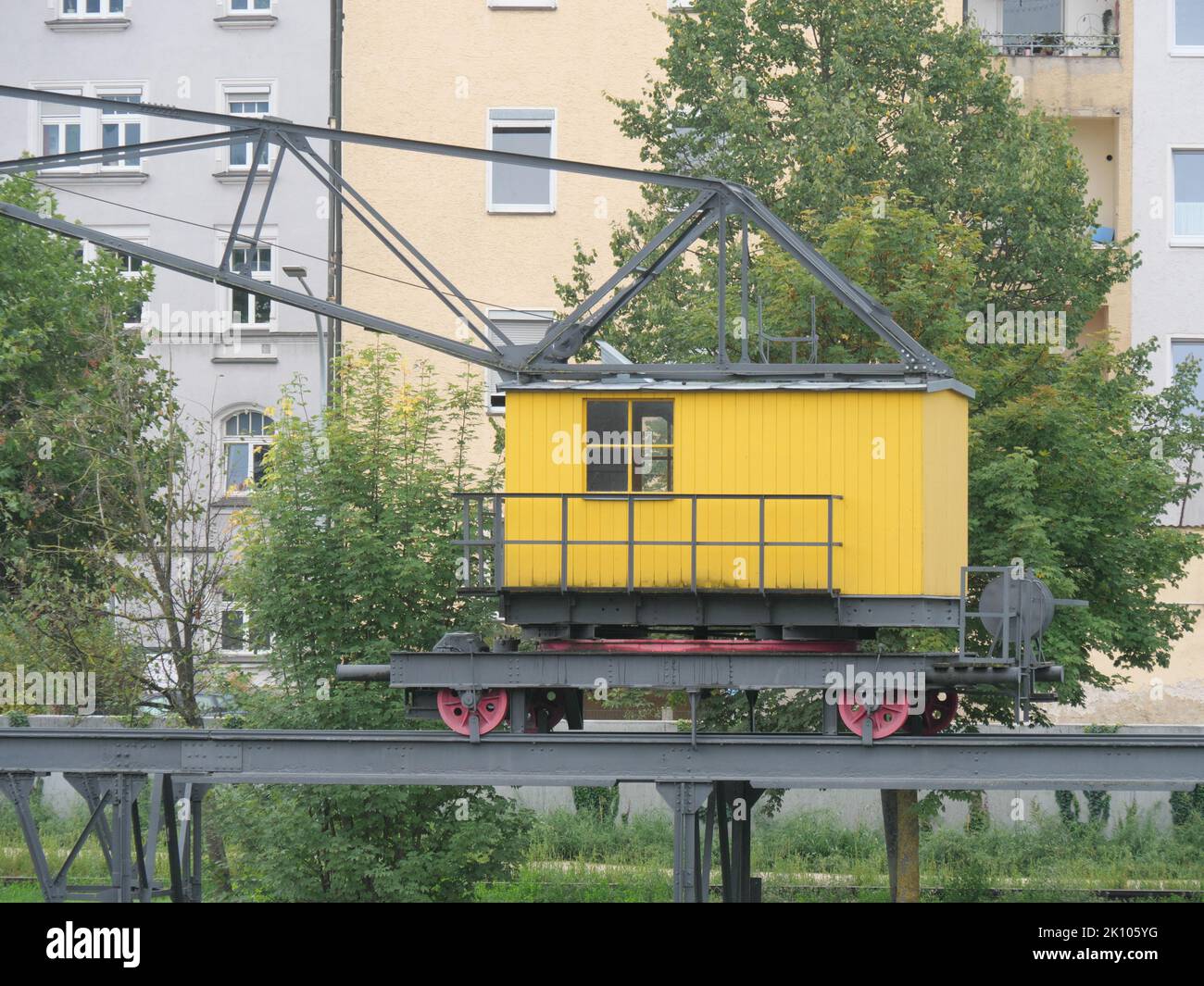 Old historical yellow loading crane running on rails for freighters on ...