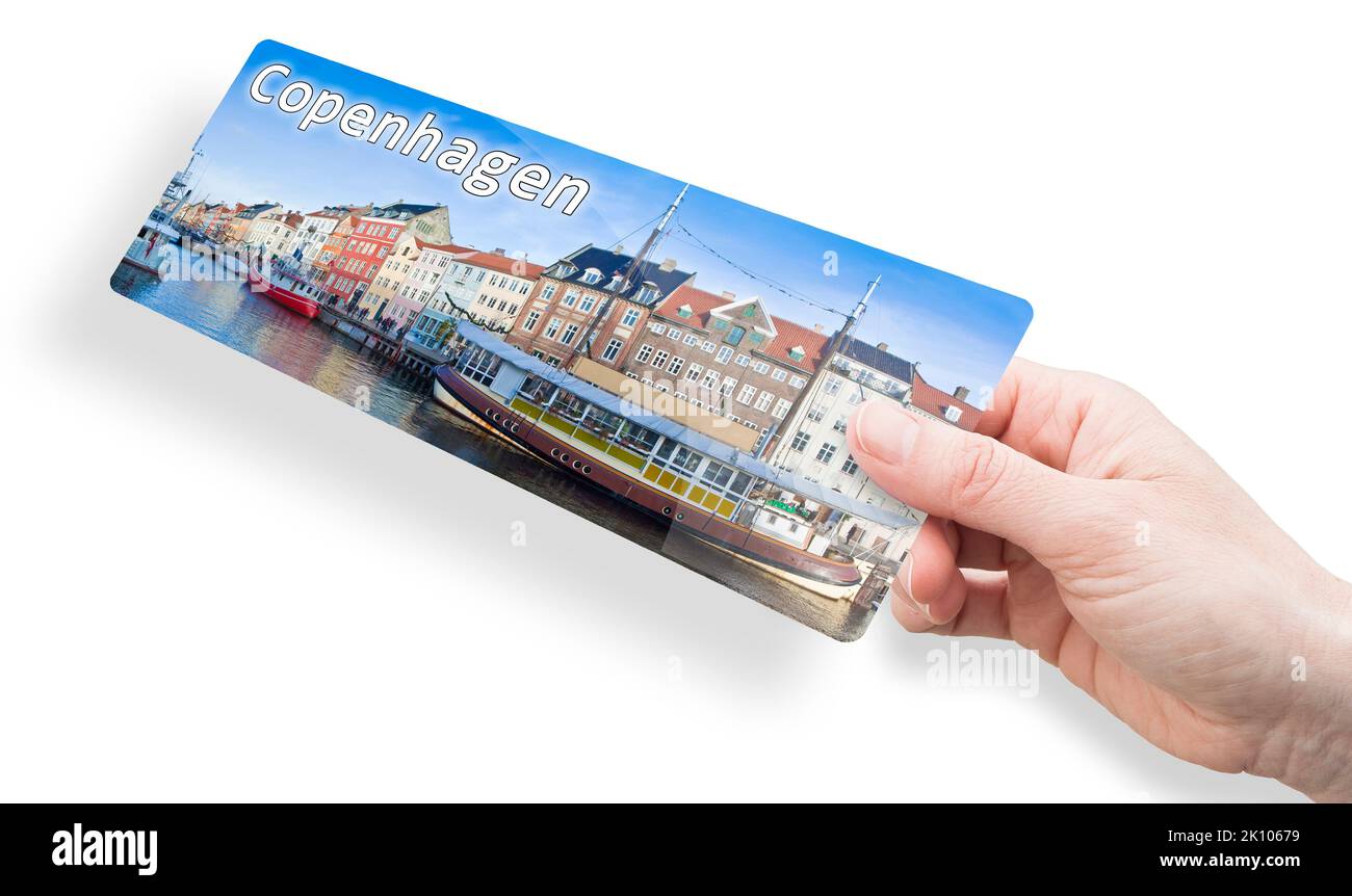 Hand of a woman holding an airplane ticket to Copenhagen with a ...