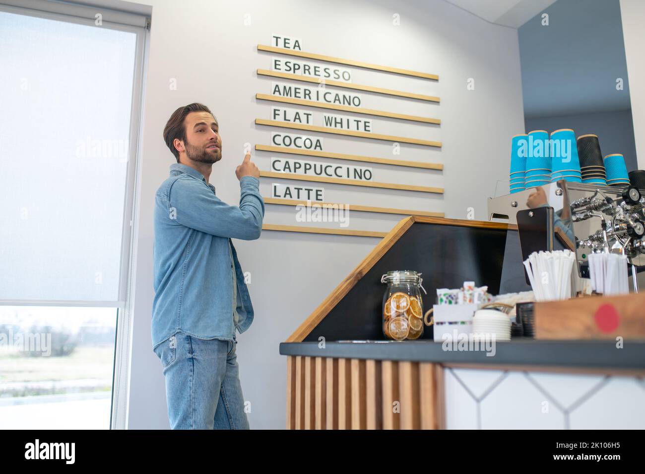 Cafe owner thinking over new idea for the menu Stock Photo - Alamy
