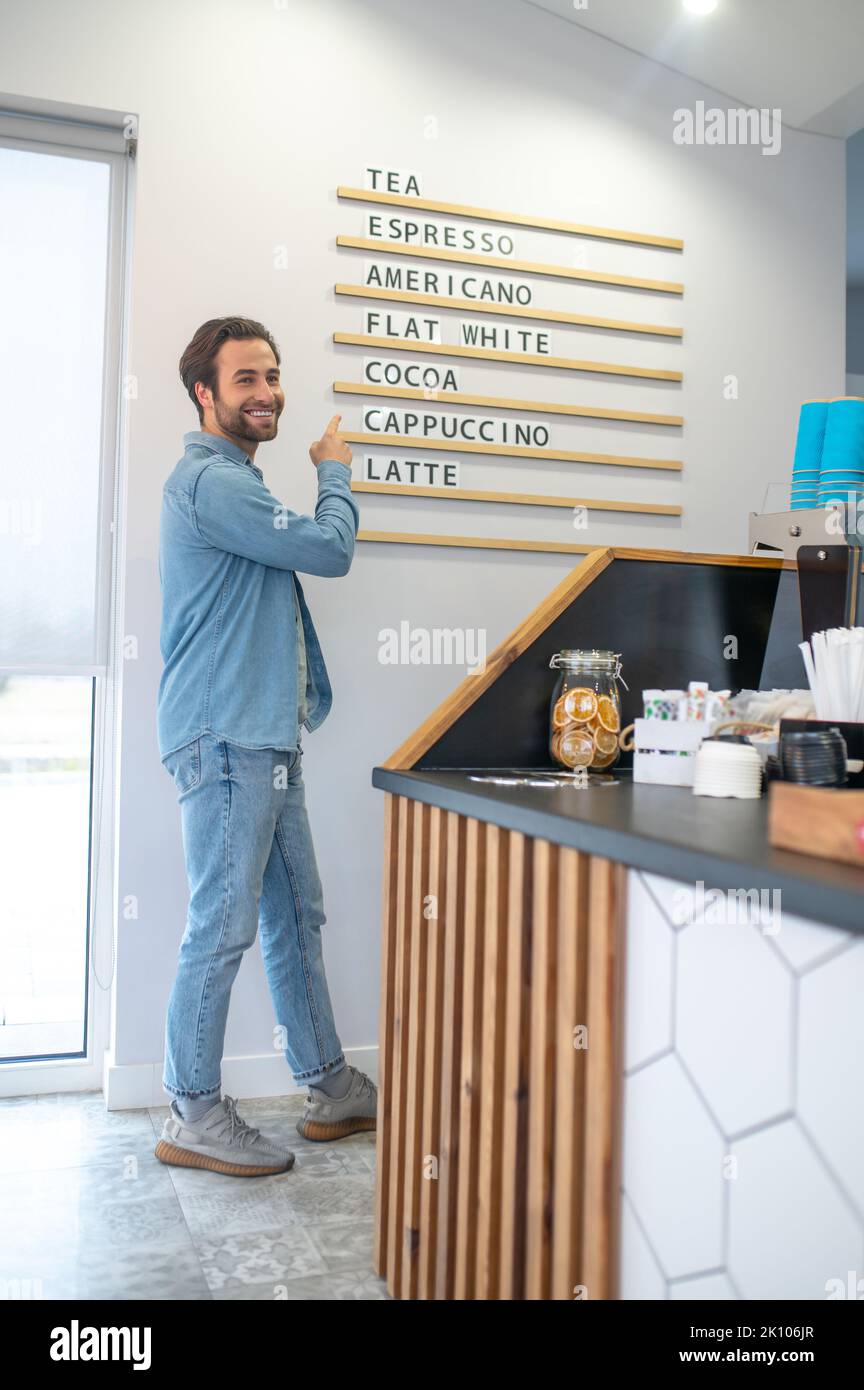 Cafe owner thinking over new idea for the menu Stock Photo - Alamy