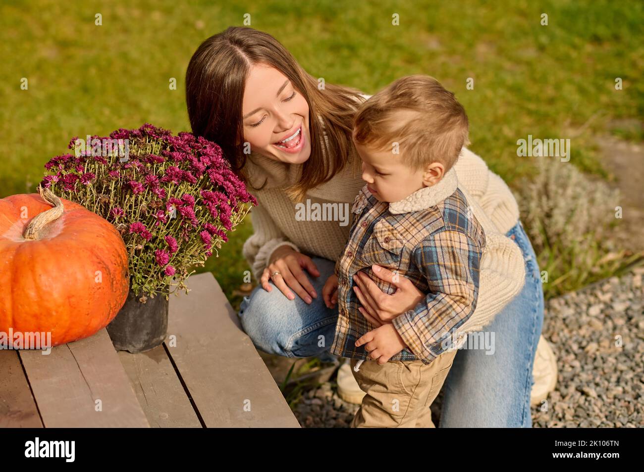 Loving female parent hugging her young child Stock Photo - Alamy