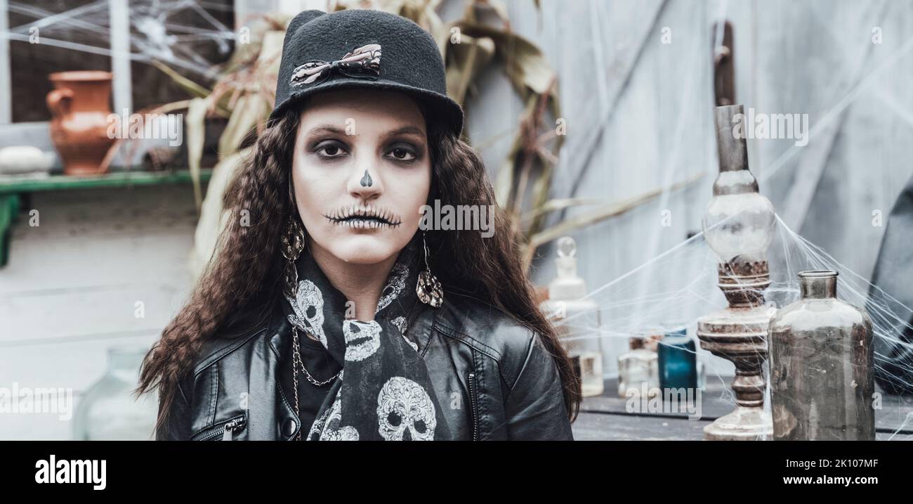 Beautiful scary little girl celebrating halloween. Terrifying black ...