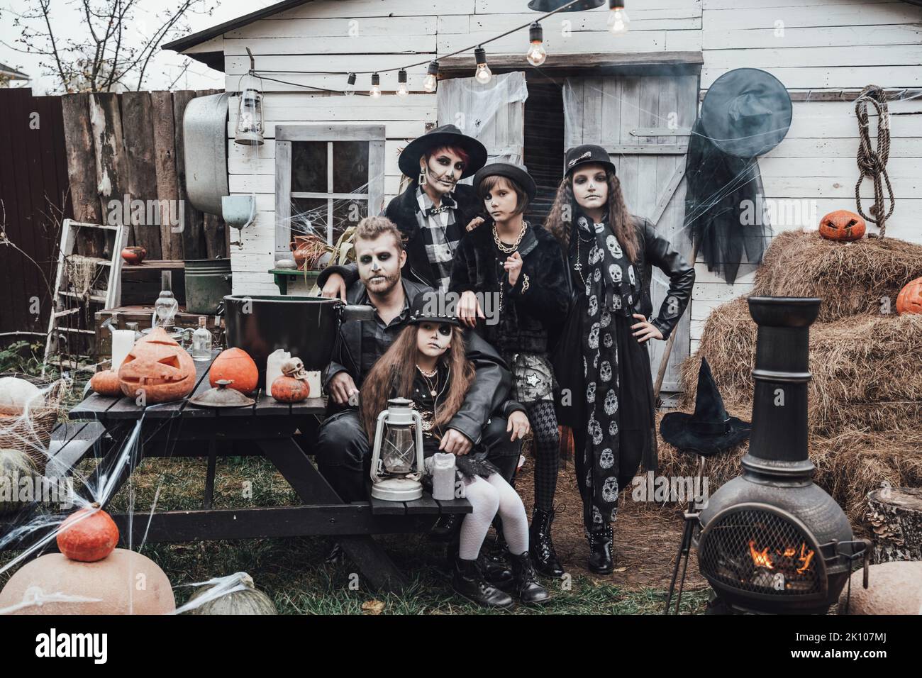 Scary family, mother, father, daughters celebrating halloween ...