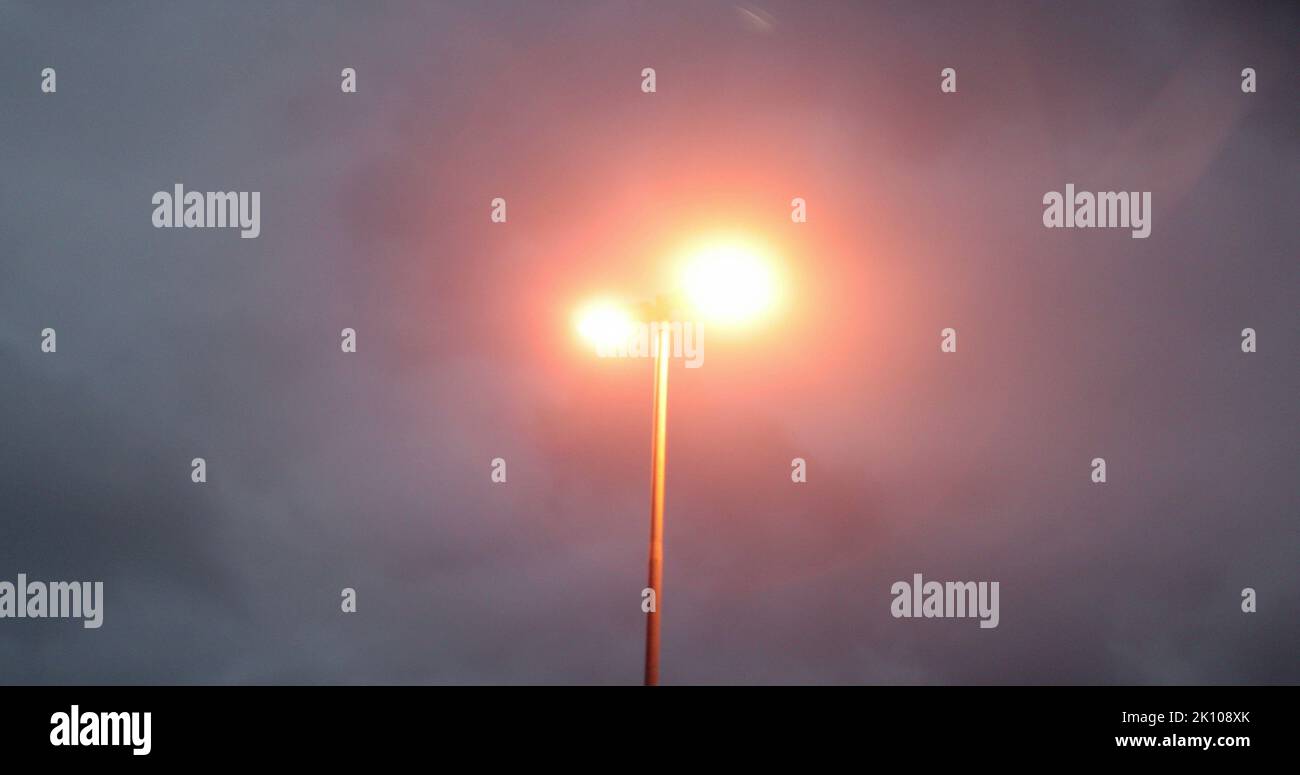 Light lamp post passing by seen through car perspective Stock Photo - Alamy
