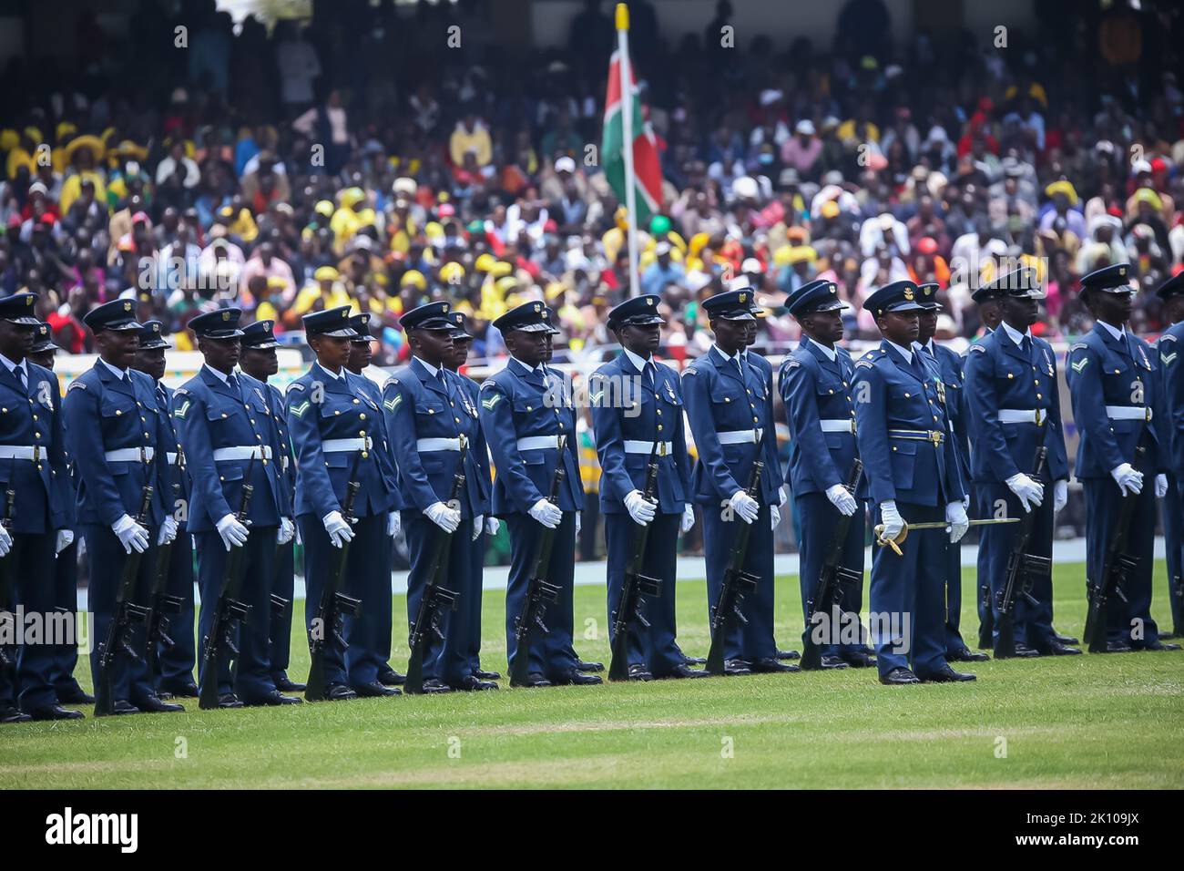 Kenyan military officers stand in line to give a guard of honor, at the ...