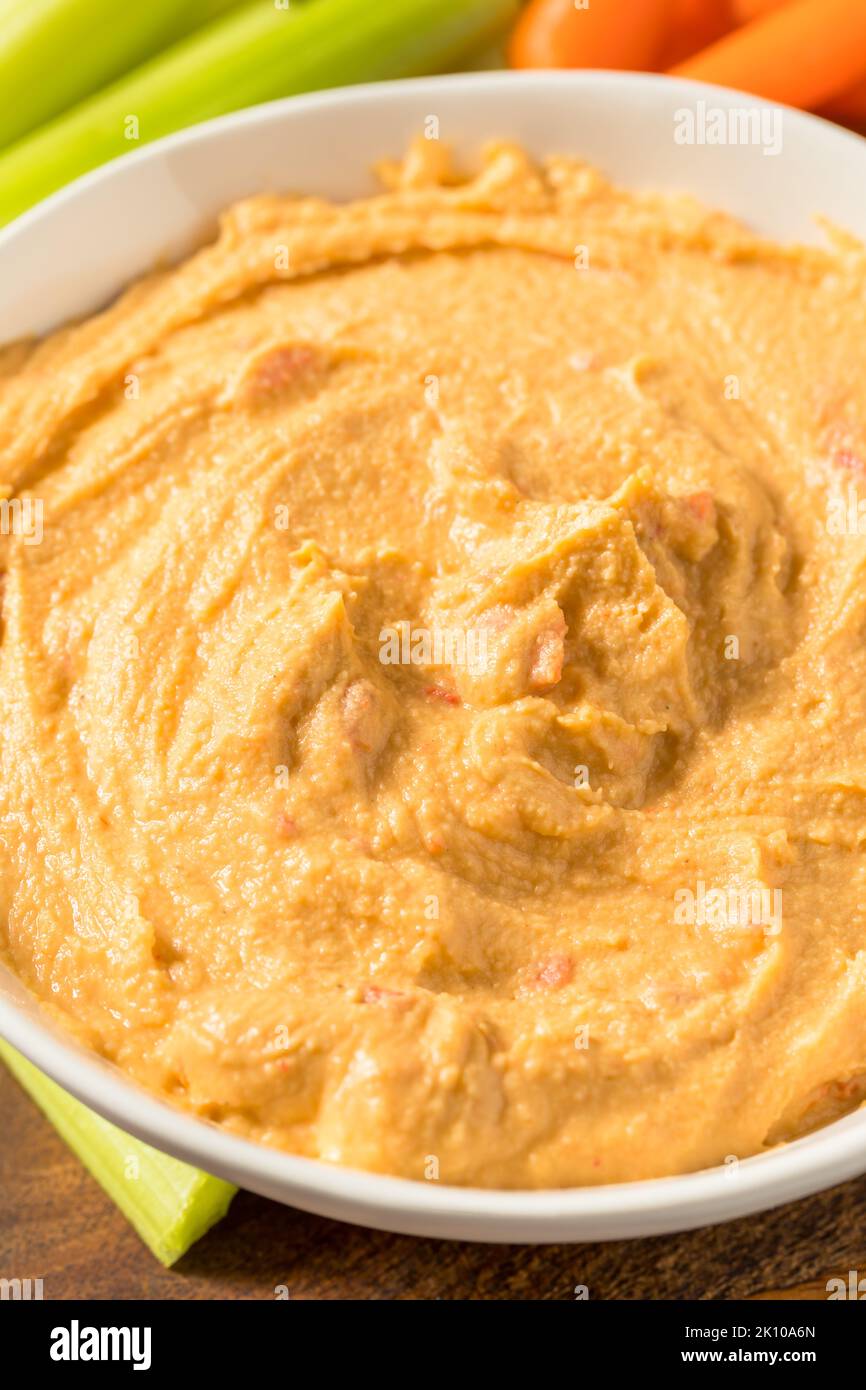 Homemade Red Pepper Hummus Dip with PIta and Veggies Stock Photo - Alamy